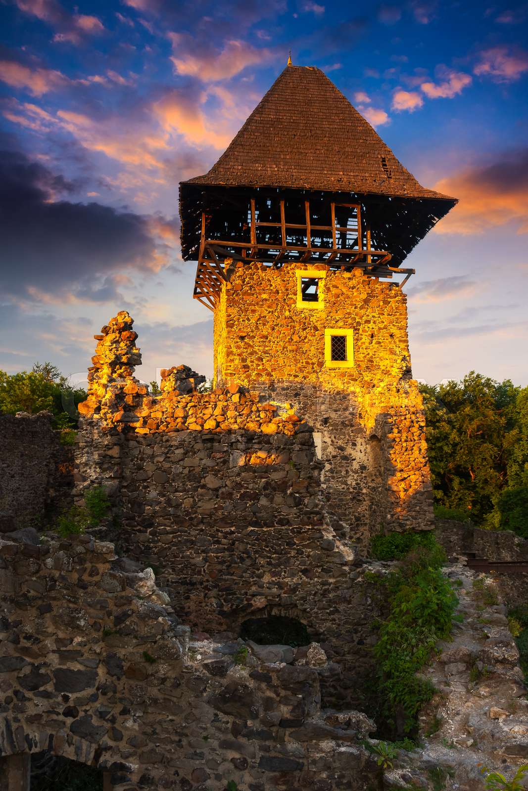 tower of the nevytske castle. ruins of ancient fortress in evening ...