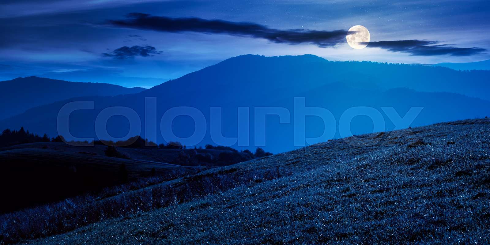 mountainous countryside landscape at night. grassy meadows and trees on ...