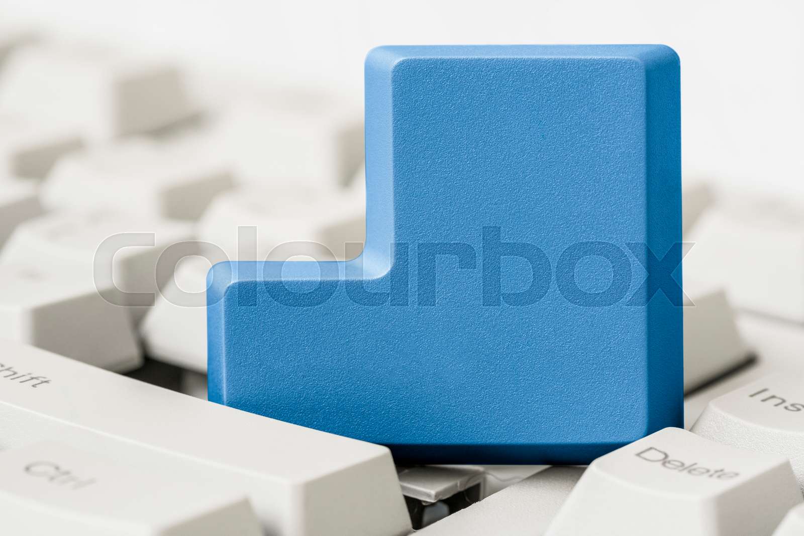 Empty blue button removed from computer keyboard | Stock image | Colourbox