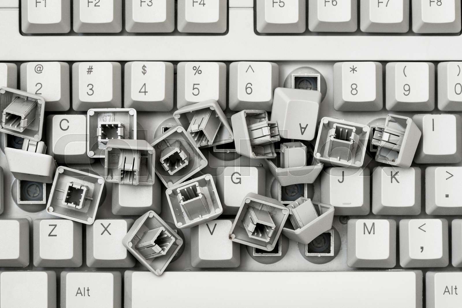 Heap of removed keys from a keyboard laying on the keyboard | Stock ...