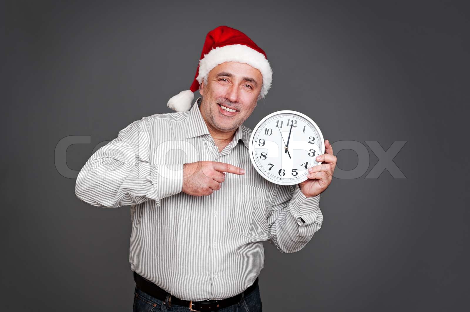 man pointing at the clock | Stock image | Colourbox