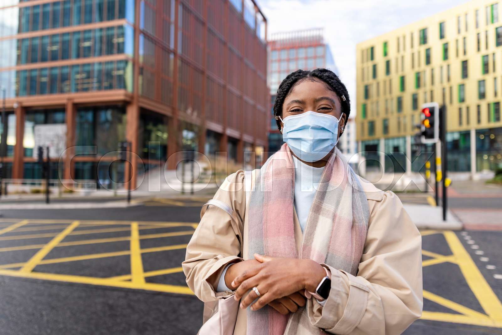 Woman Looking Towards Camera Wearing Face Mask | Stock image | Colourbox