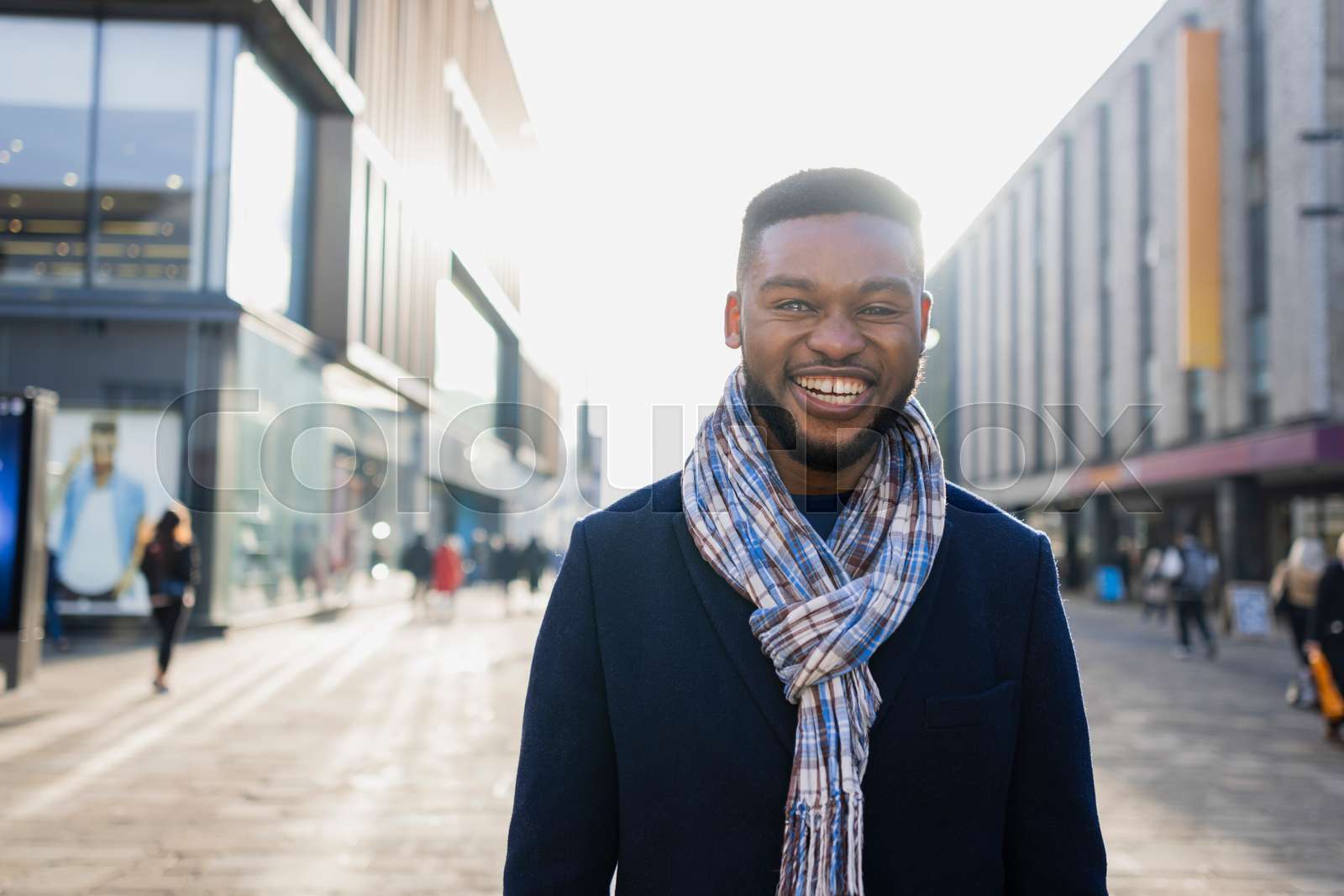 Portrait of Man Wearing Scarf in Town Smiling Towards Camera | Stock ...
