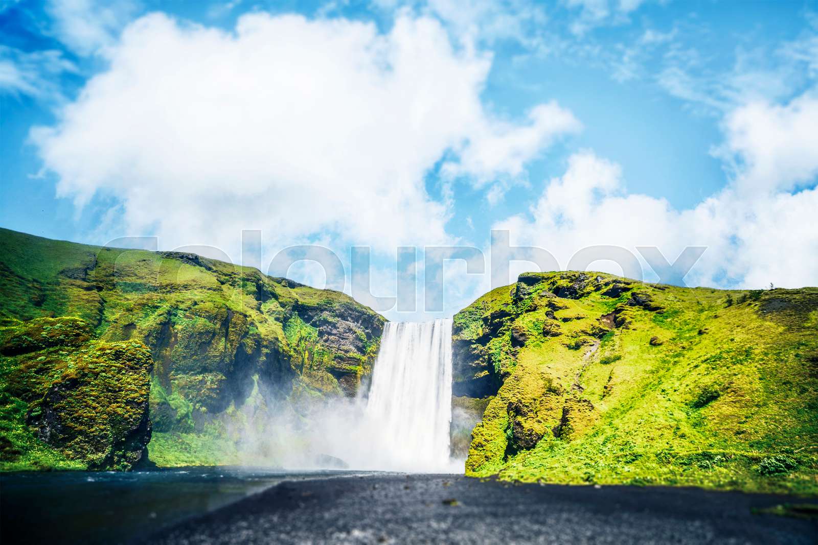 Waterfall between green cliffs | Stock image | Colourbox