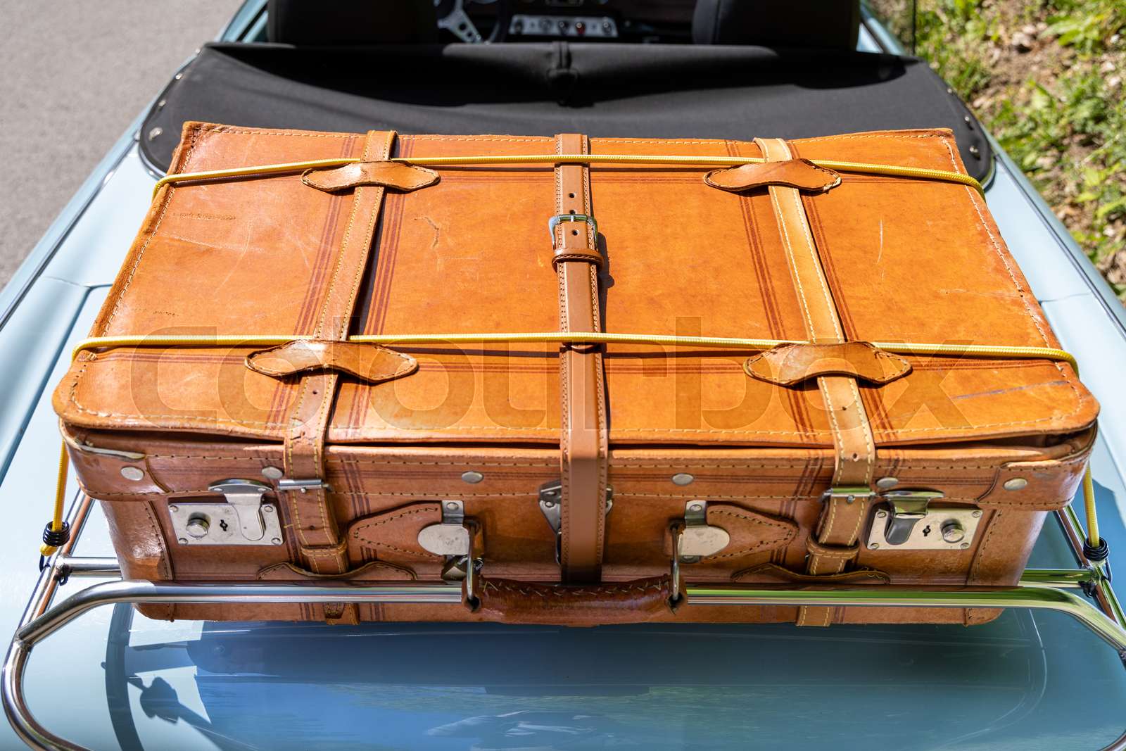 Leather suitcase on the trunk of an vintage car | Stock image | Colourbox