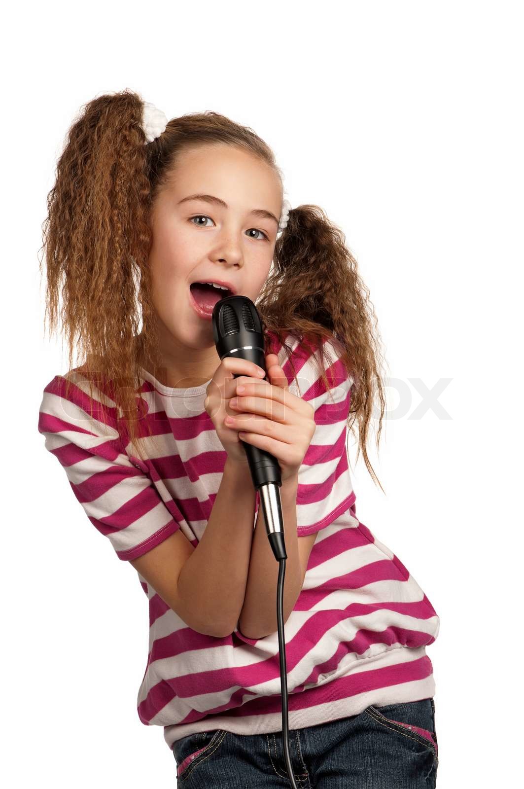 Girl with microphone | Stock image | Colourbox