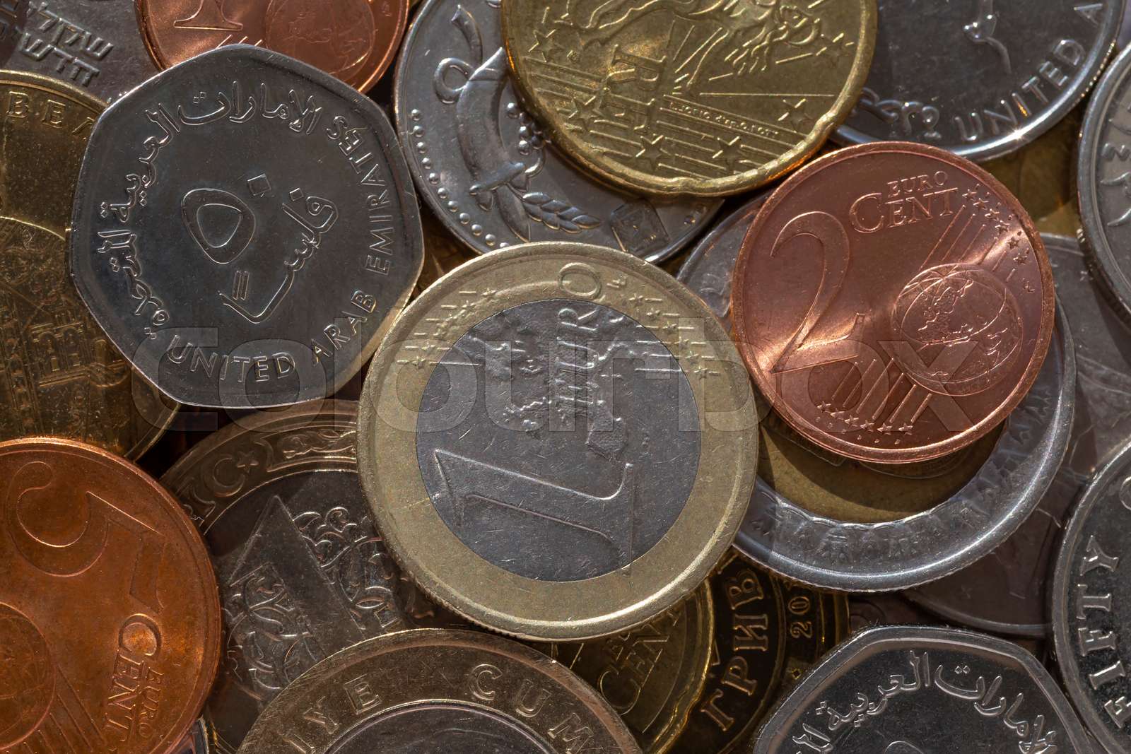 heap of different currencies coins | Stock image | Colourbox