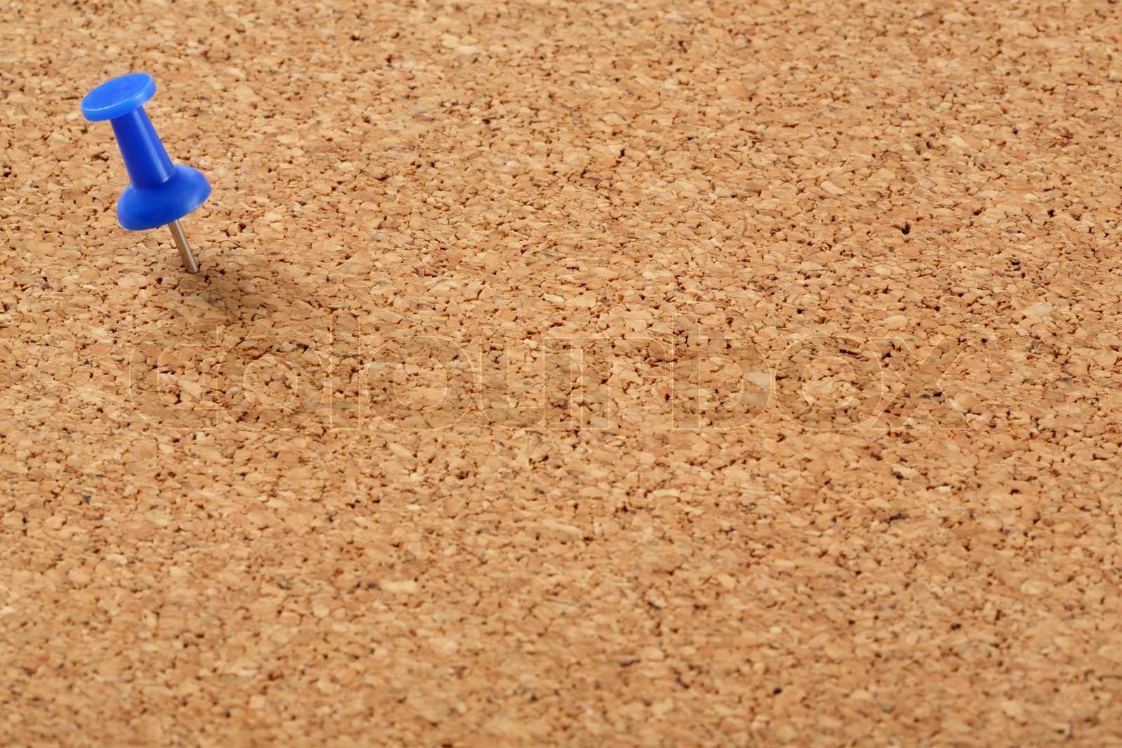 Cork board with blue pin | Stock image | Colourbox