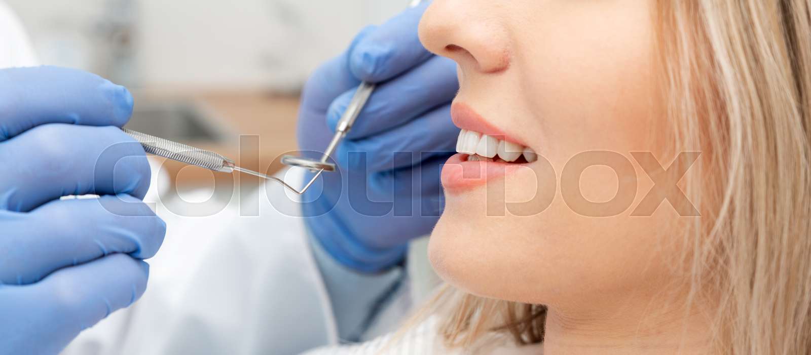 Patient in dentist office. Perfect smile. | Stock image | Colourbox