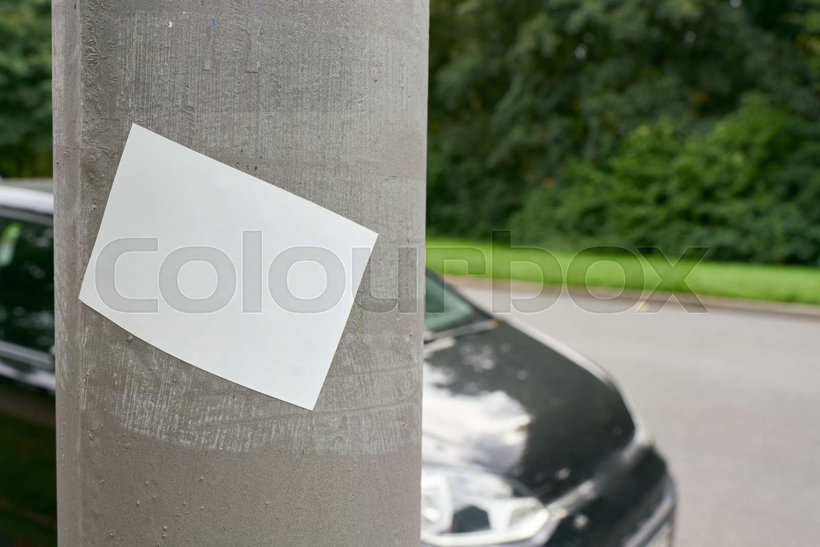 blank white sticker with space for text on roadside pillar | Stock ...