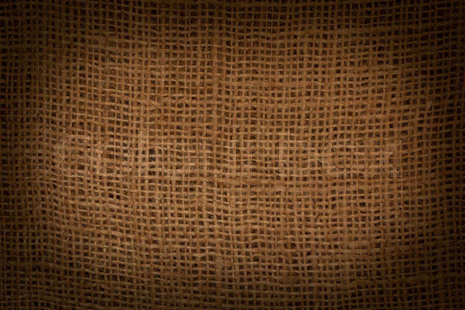 dark brown sacking texture with darker border | Stock image | Colourbox