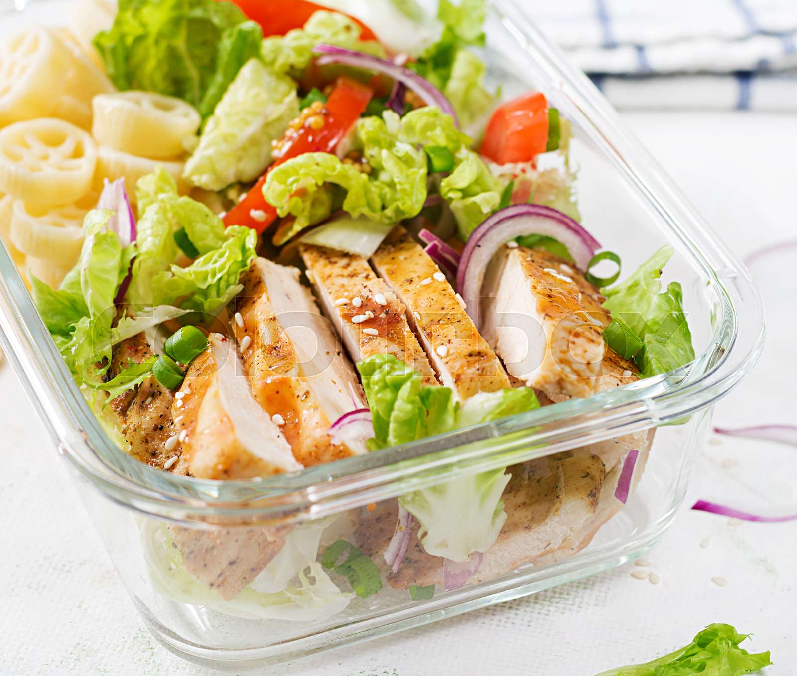 Lunchbox. Lunch box with grilled chicken fillet and pasta salad with ...