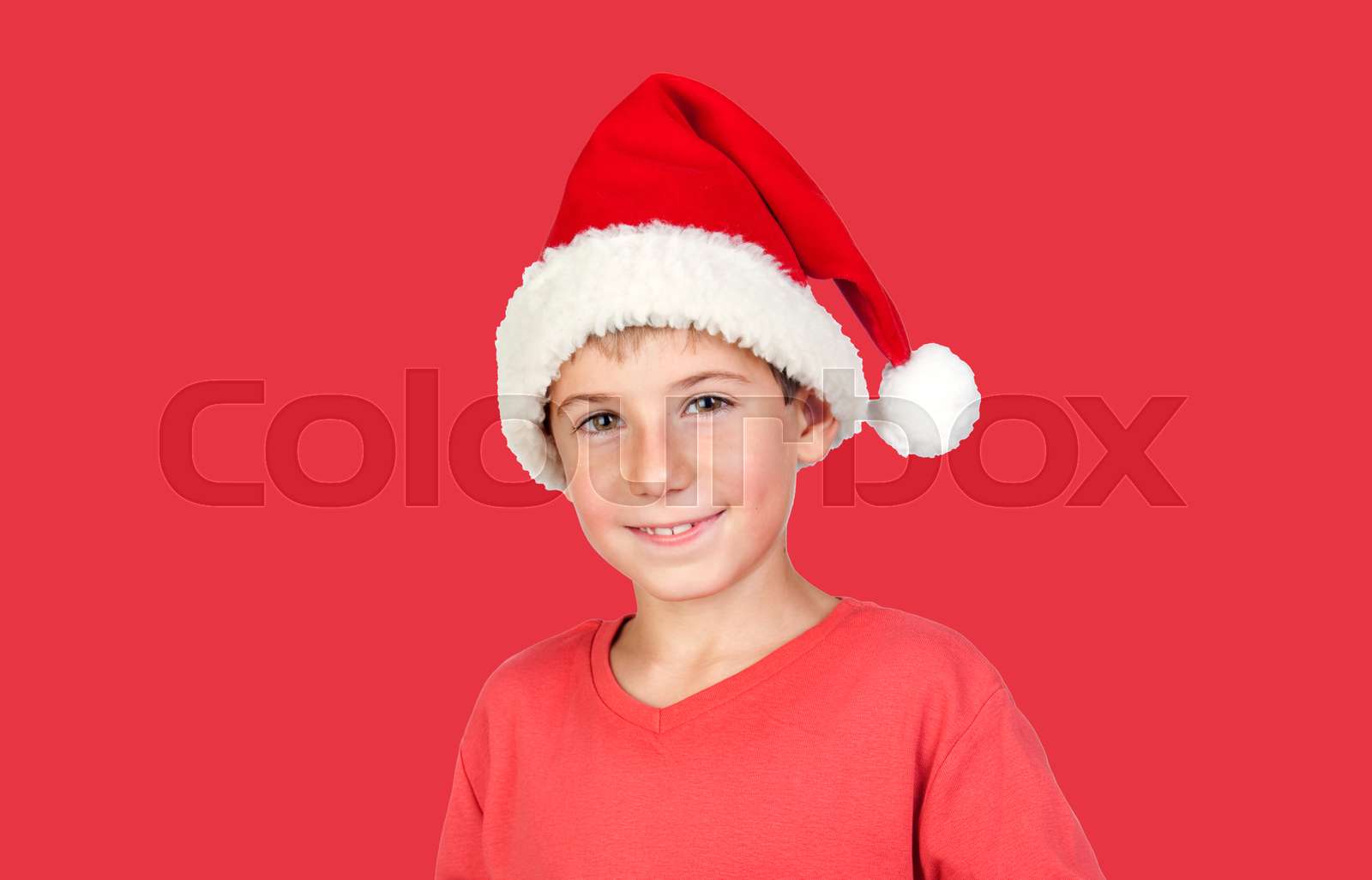 Adorable child with Santa Hat | Stock image | Colourbox