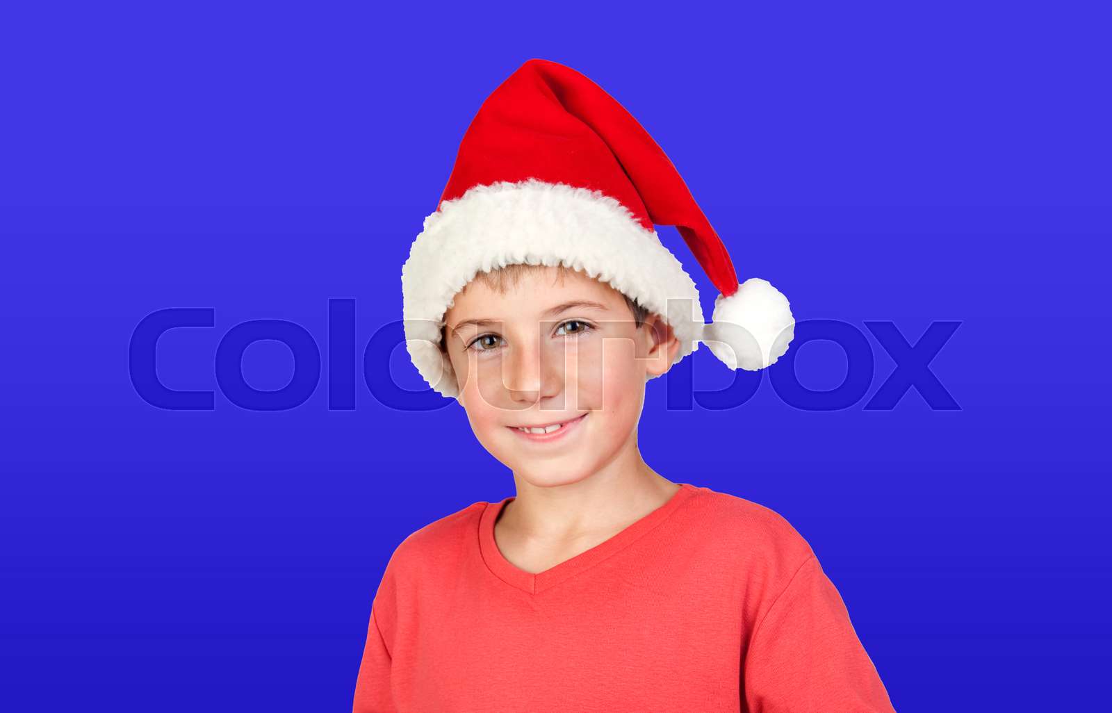 Adorable child with Santa Hat | Stock image | Colourbox