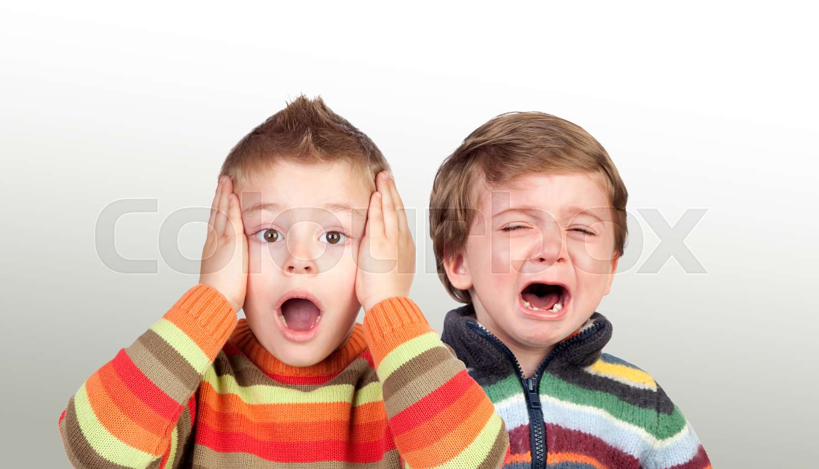 Two funny small brothers showing emotions | Stock image | Colourbox
