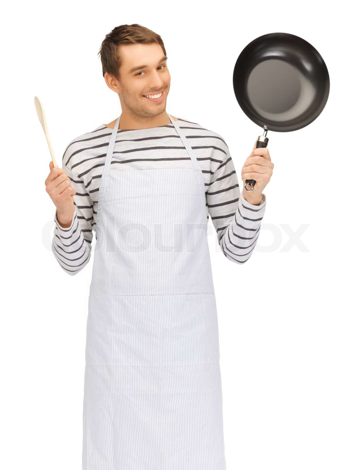 handsome man with pan and spoon | Stock image | Colourbox
