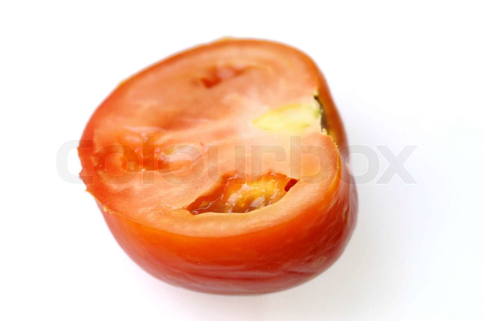 Cutting a tomato | Stock image | Colourbox