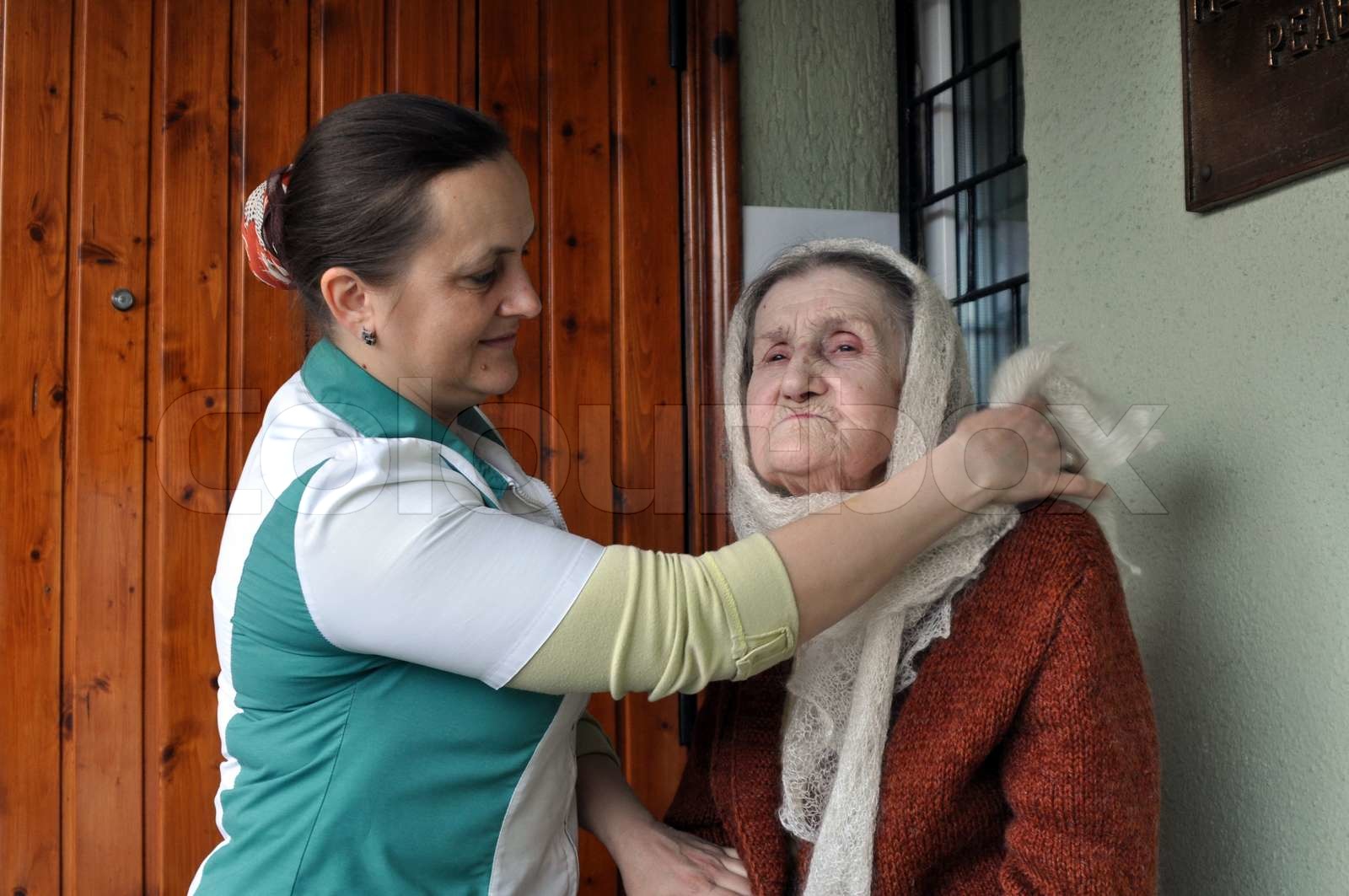 Nurse helping an old woman | Stock image | Colourbox