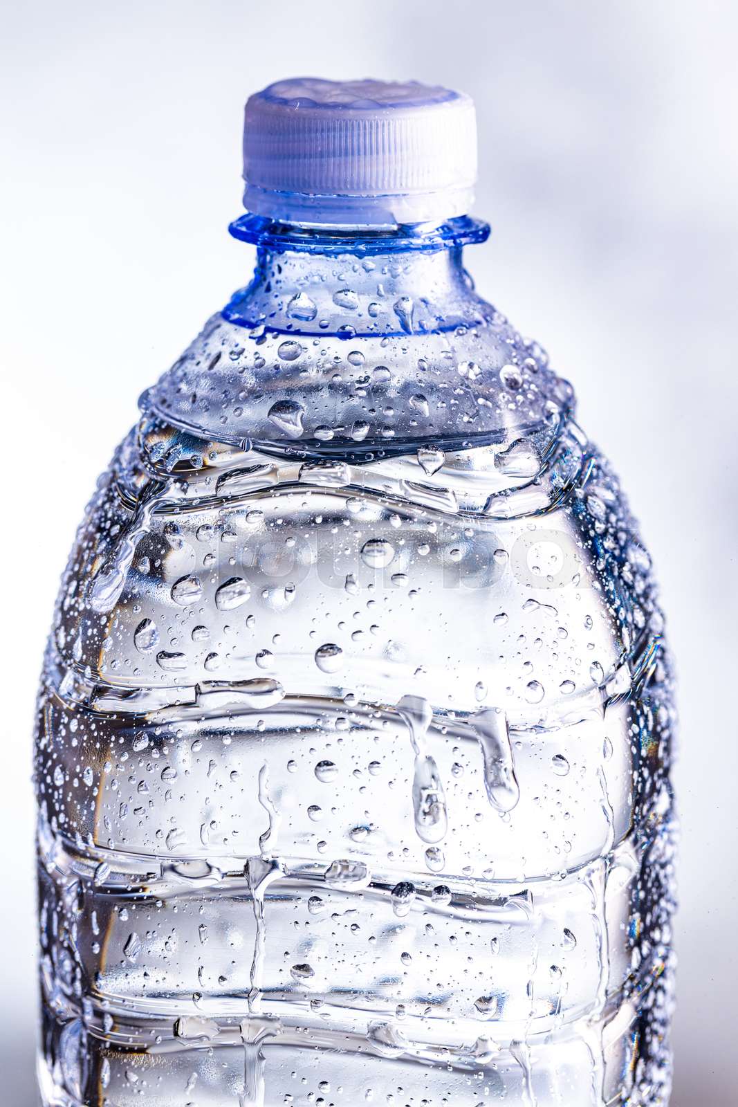 Detail of plastic cold bottle of water with water drops. | Stock image ...