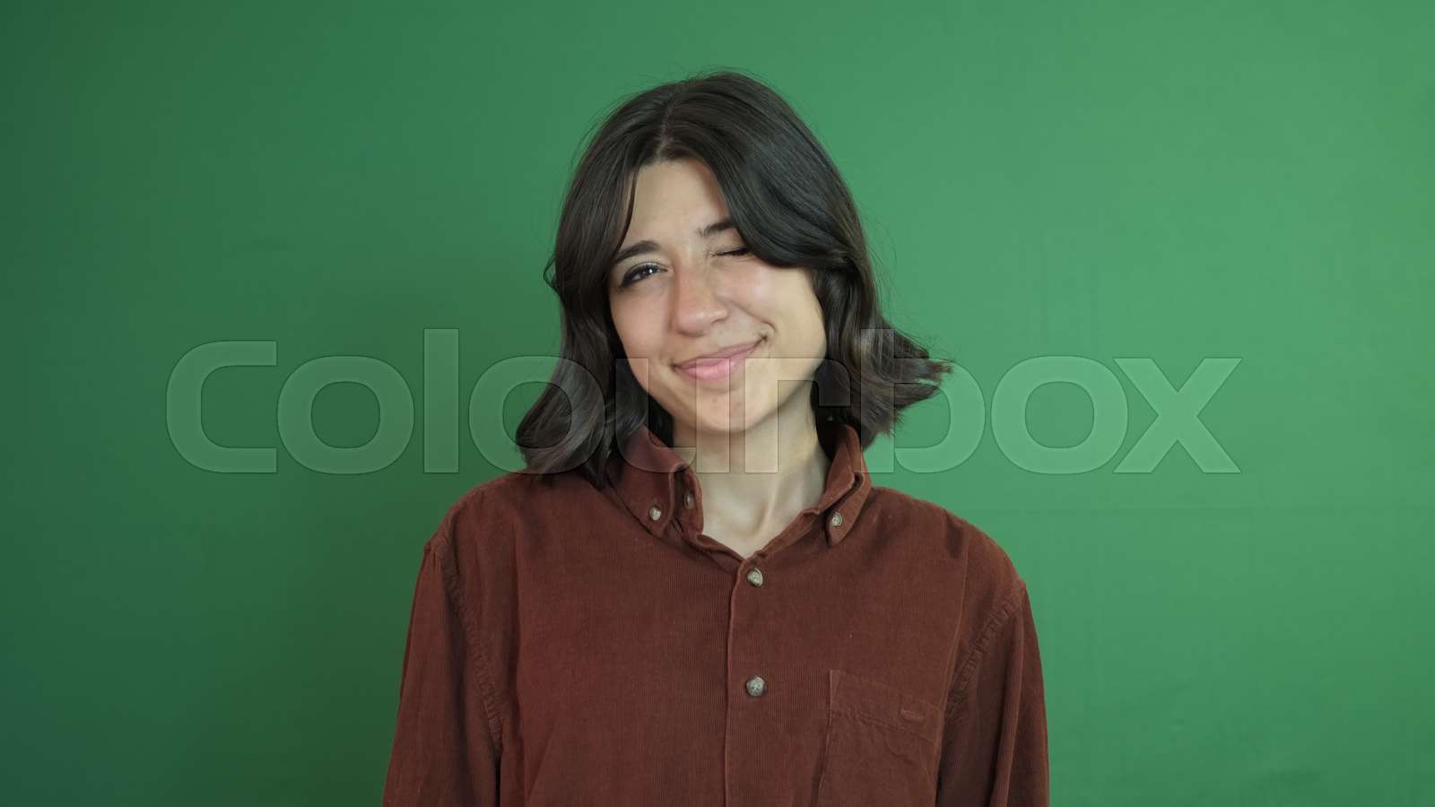 Women Blinking On Green Curtain | Stock video | Colourbox