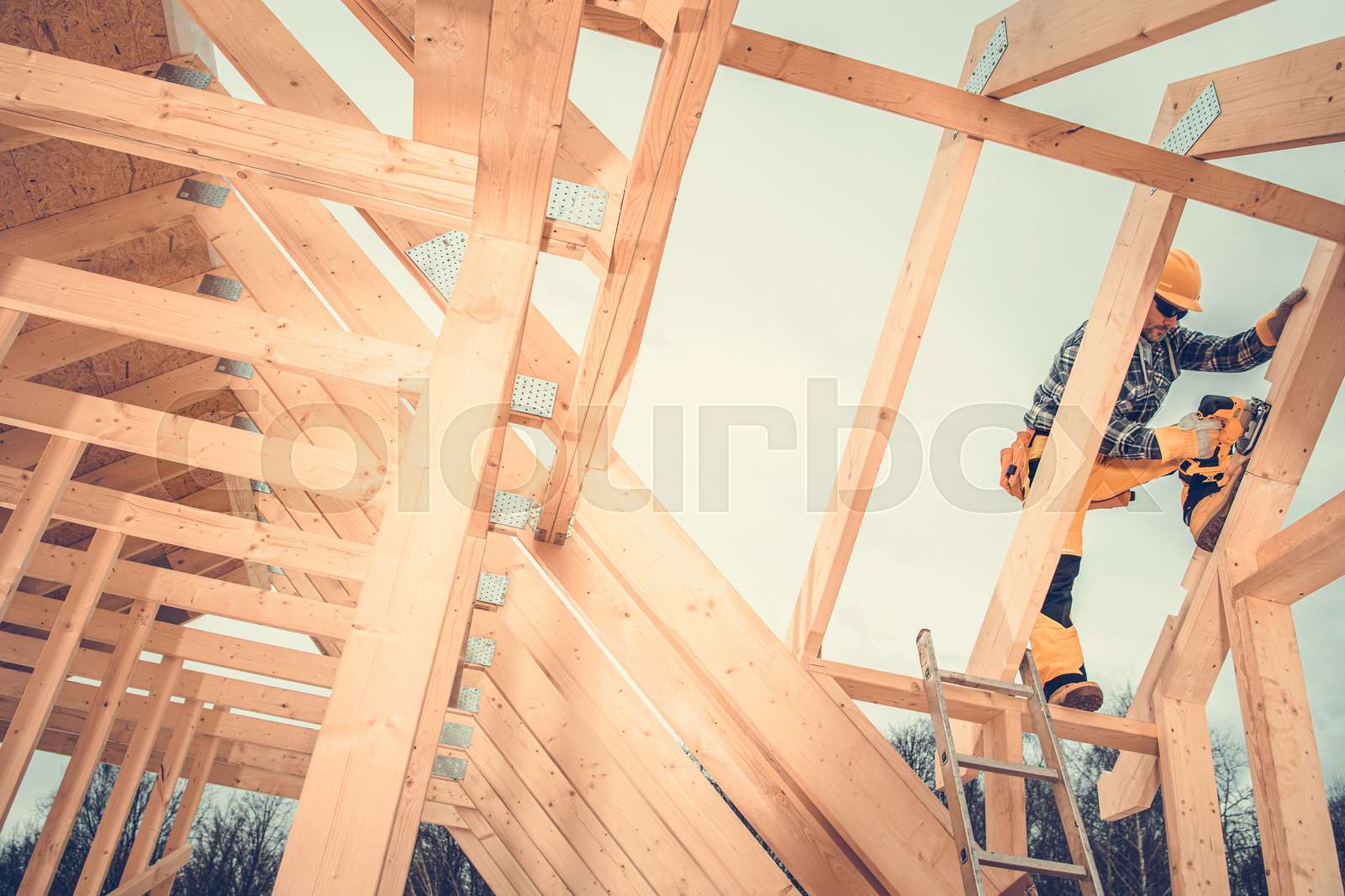 Contractor Finishing the Wooden Skeleton of the House | Stock image ...