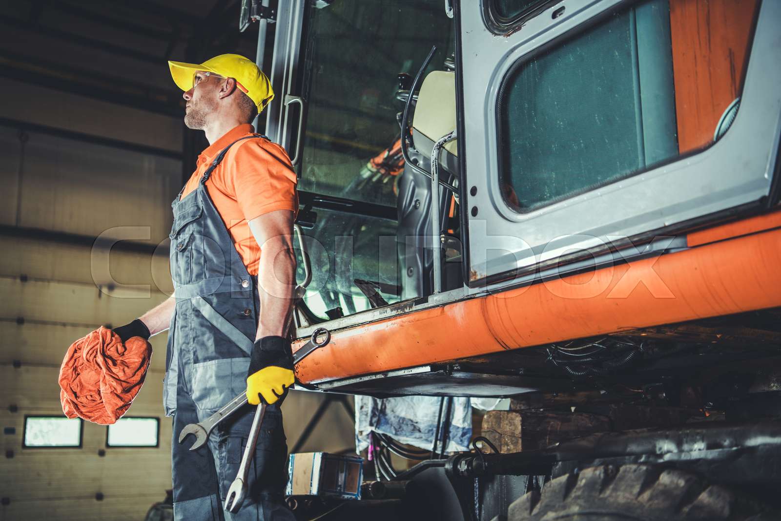 Proud Mechanic After Successful Excavator Repair | Stock image | Colourbox