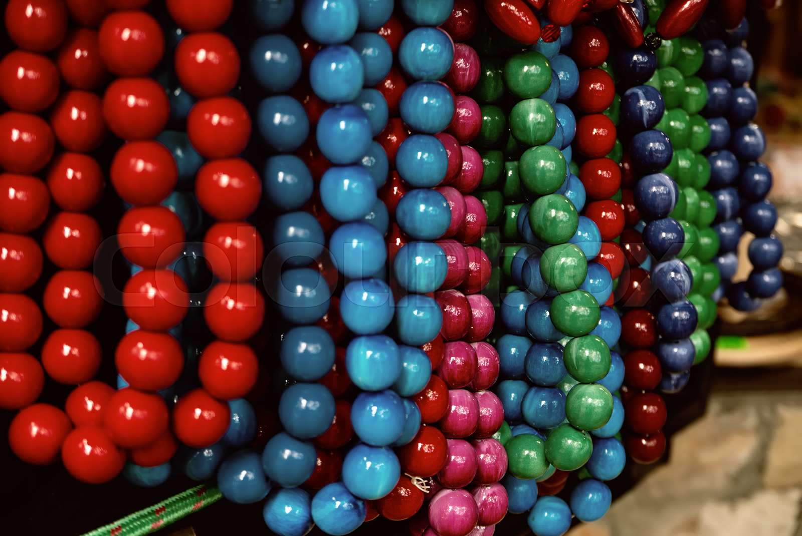 Wooden red beads on the market | Stock image | Colourbox