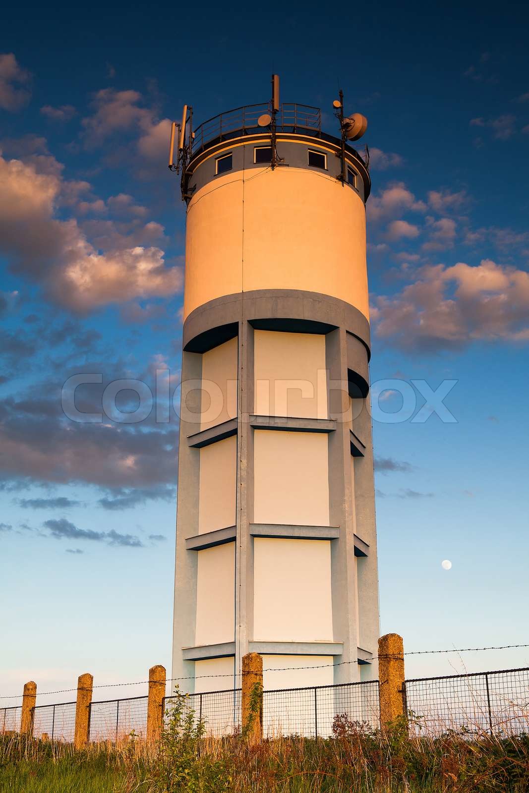 Historic water reservoir brick tower at sunset | Stock image | Colourbox