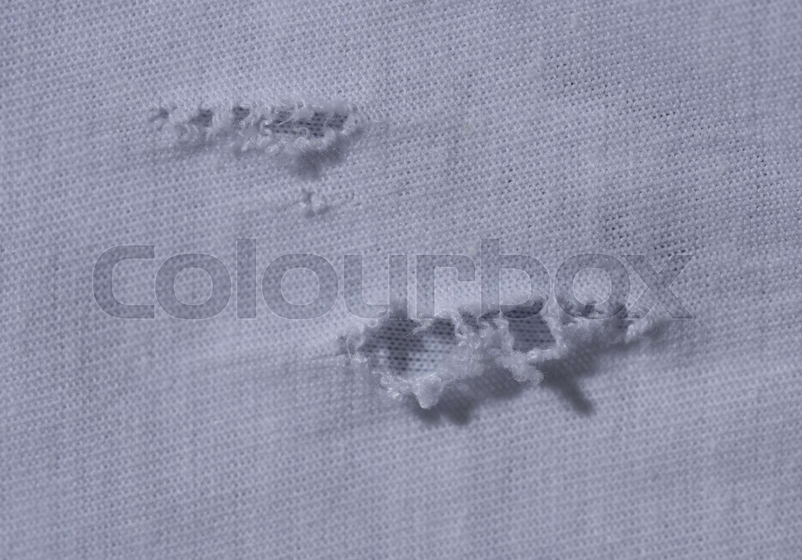 Clothes torn due to decay of the fabric,fabric damage | Stock image ...