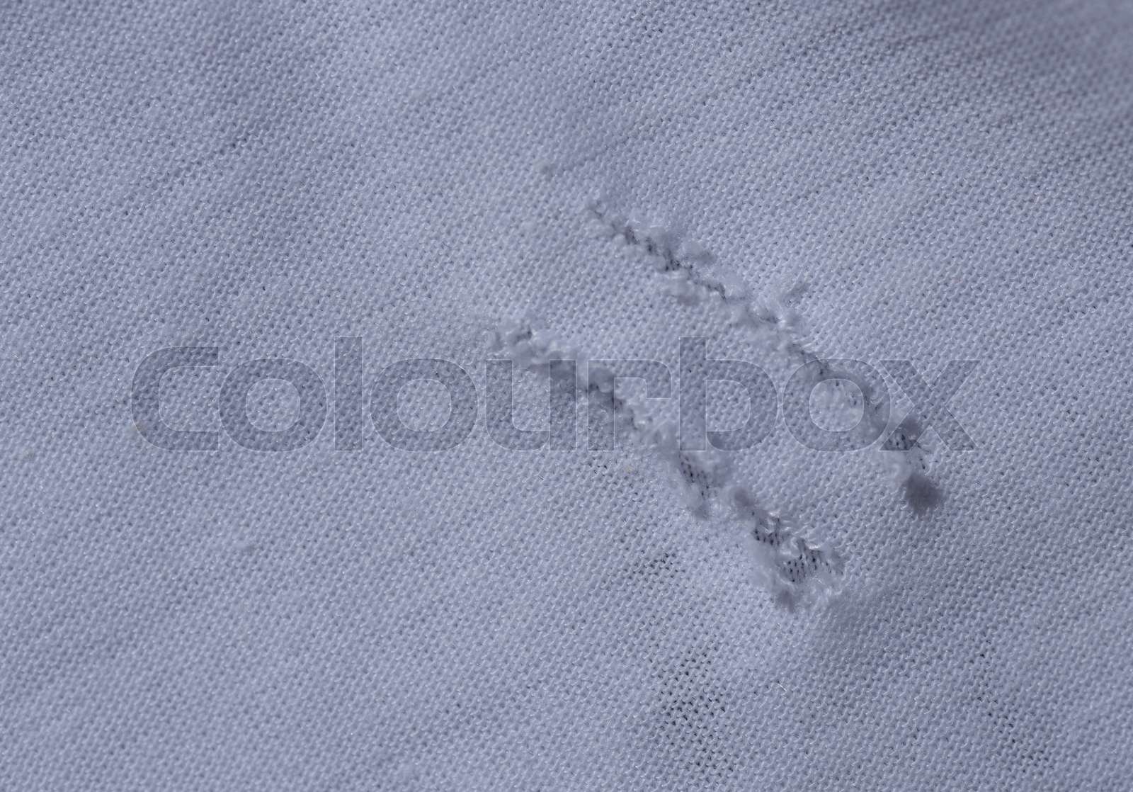 Clothes torn due to decay of the fabric,fabric damage | Stock image ...