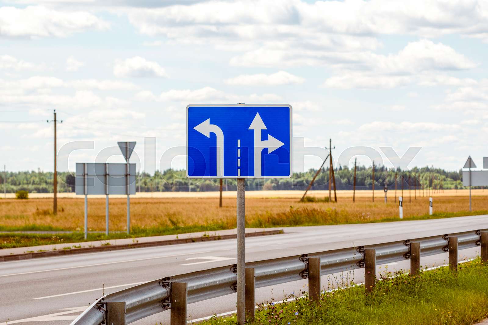 Road signpost for appropriate traffic lanes at crossroads junction ...