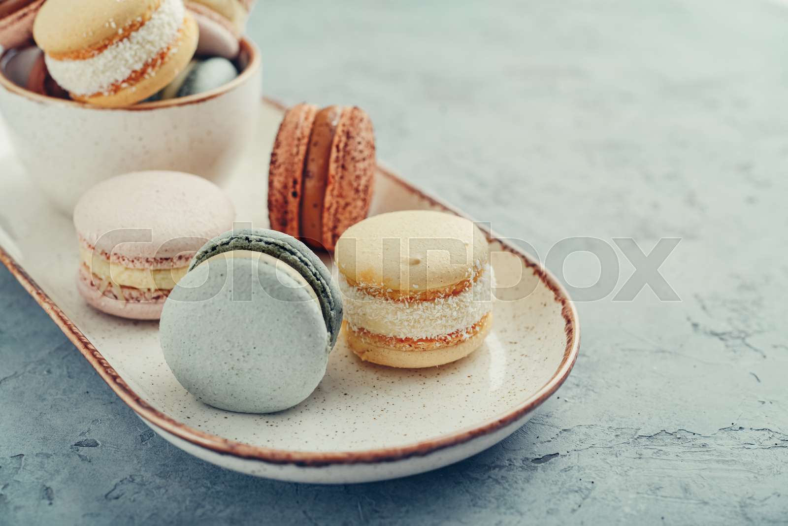 Colorful french macarons on plate | Stock image | Colourbox
