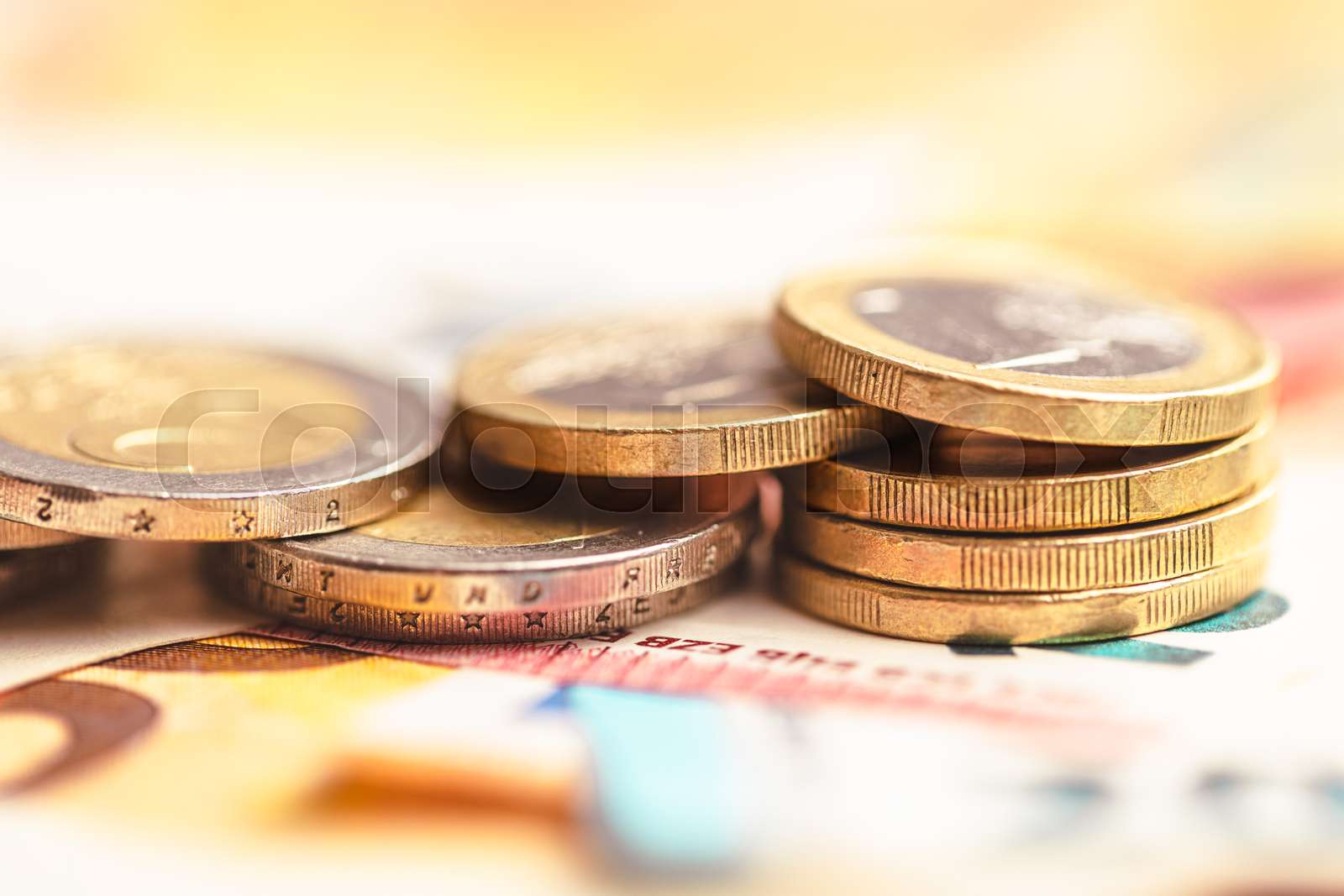 Euro coins on paper euro banknotes | Stock image | Colourbox