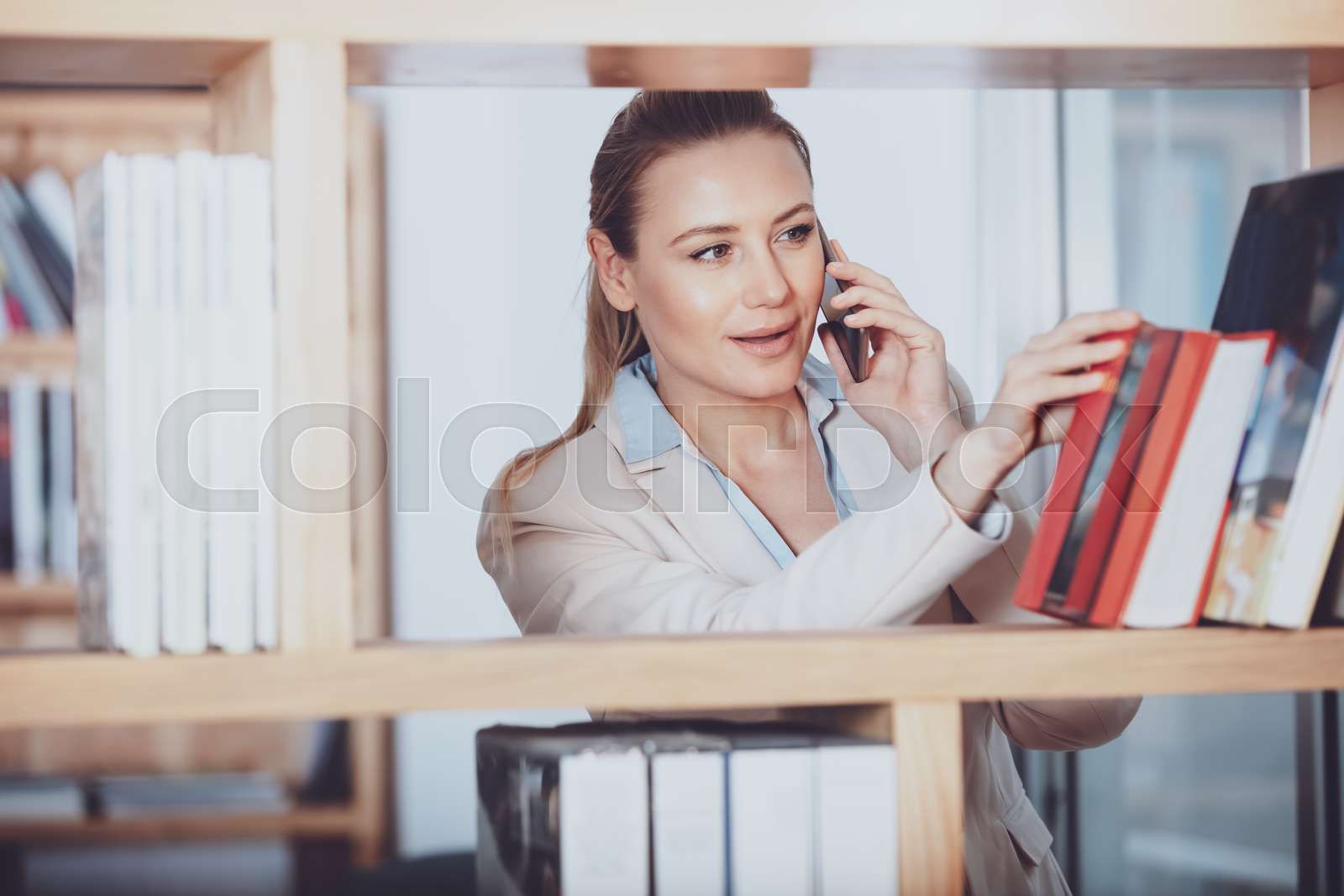 Nice Female in a Bookstore | Stock image | Colourbox