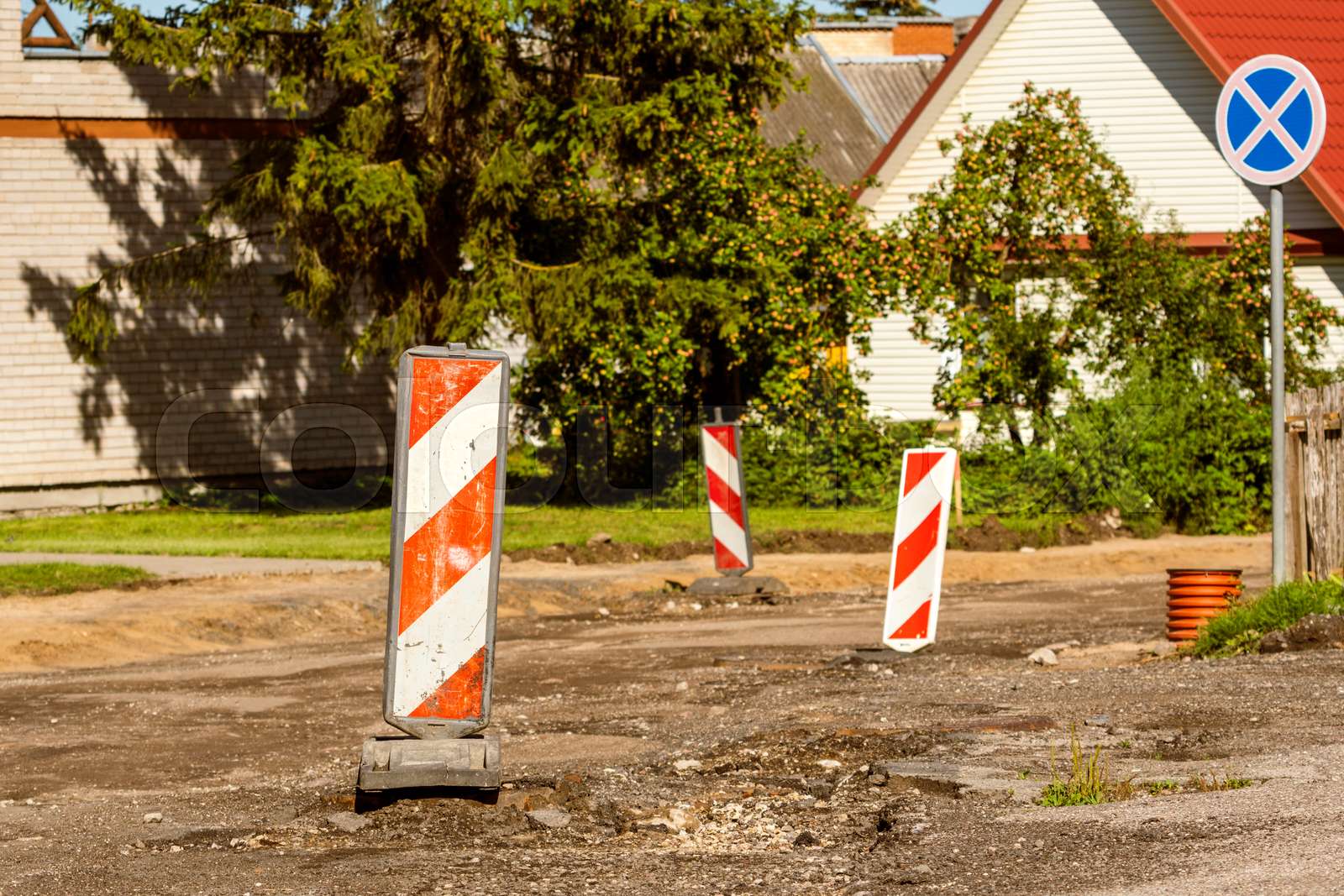 Red and white striped traffic control devices for avoiding sections of ...