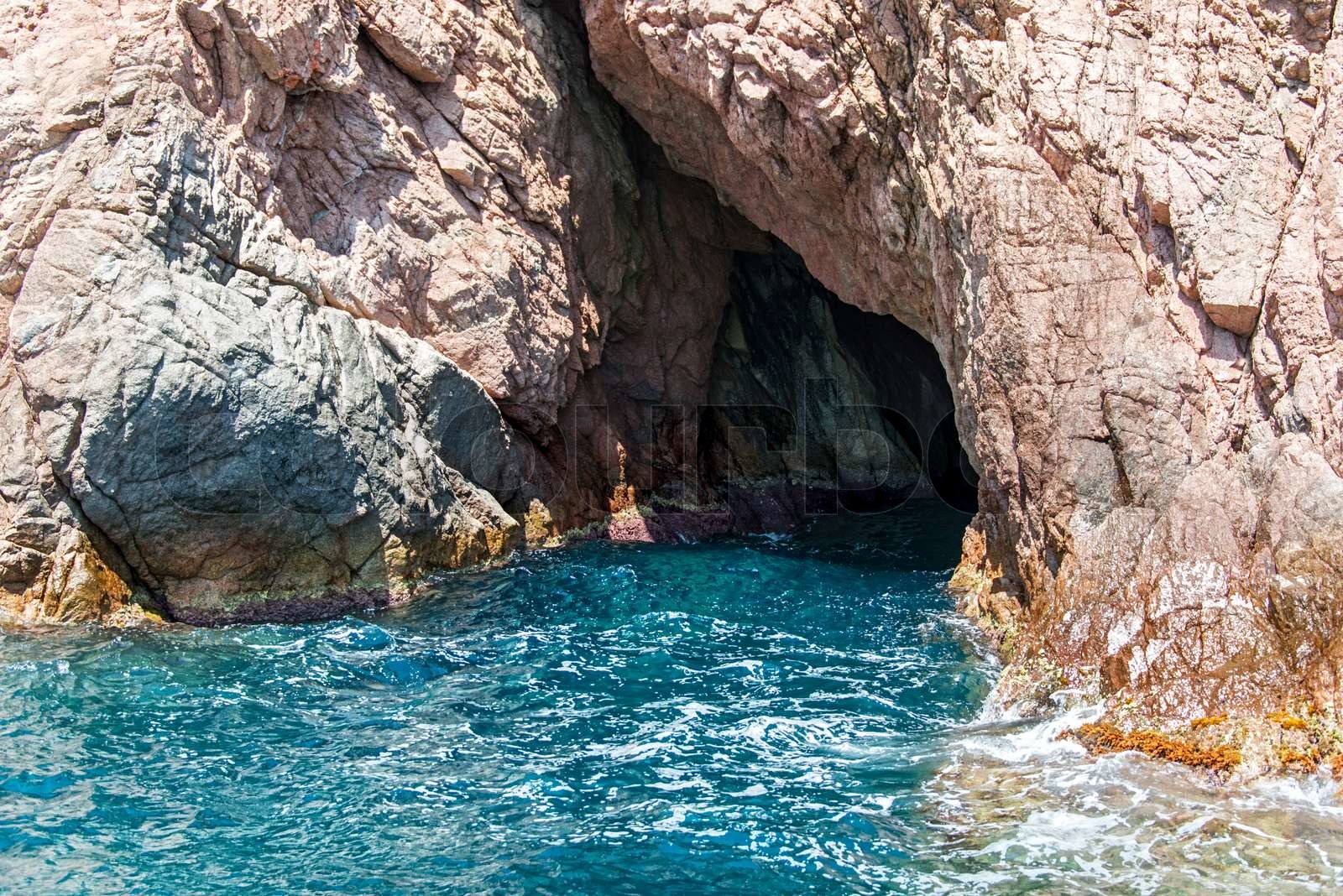 Entrance To Sea Cave On Shoreline Of Costa Brava Catalonia Stock