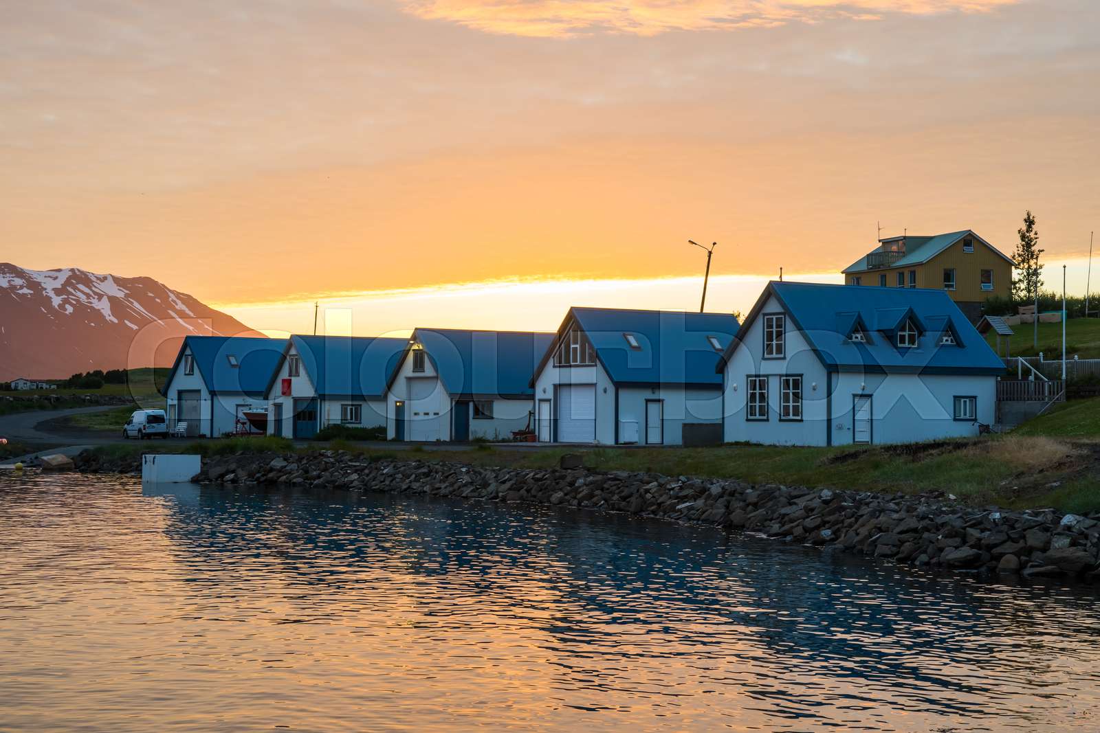 Summer sunset in the village on island of Hrisey in Iceland | Stock ...