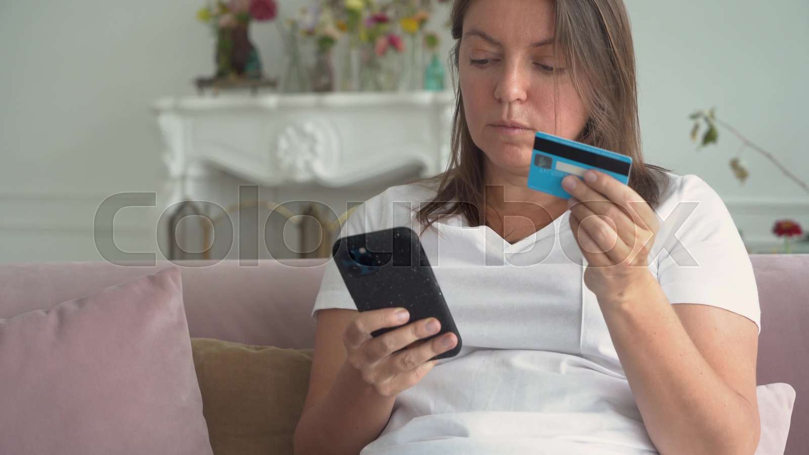 woman shopping through the phone | Stock video | Colourbox
