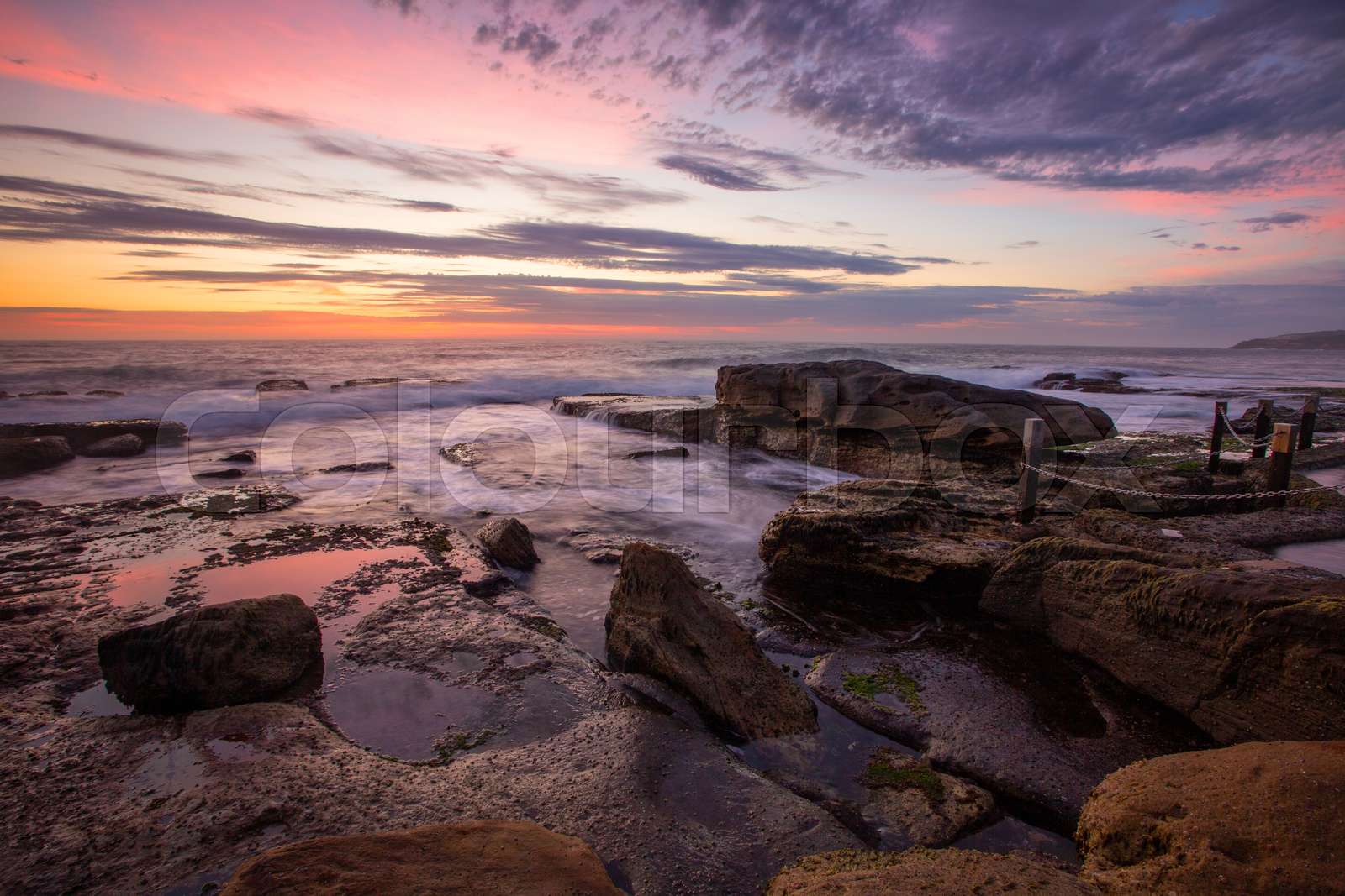 SPretty snrise reflected in ocean rock pools by the beach | Stock image ...