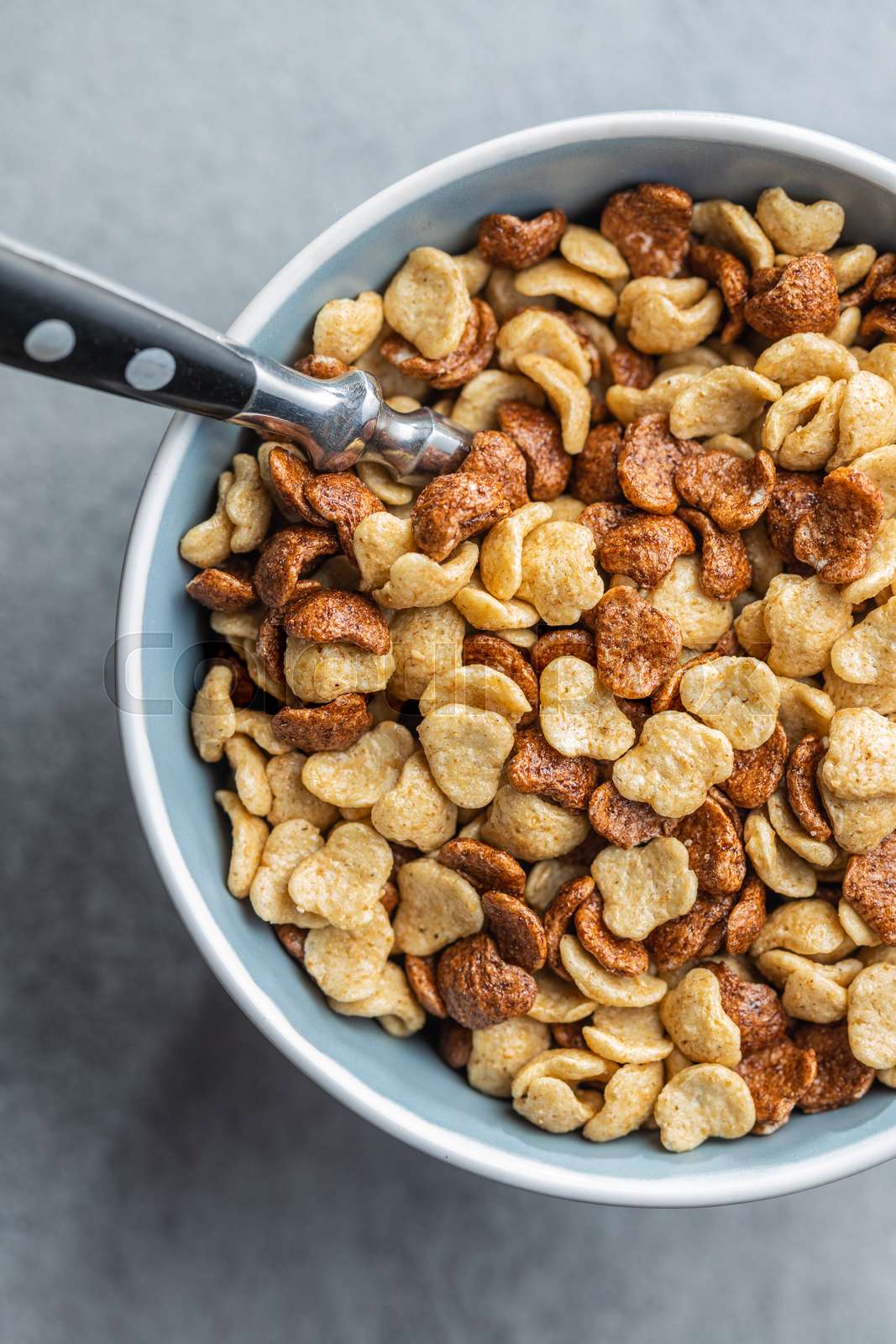 Breakfast cereal flakes in bowl. | Stock image | Colourbox