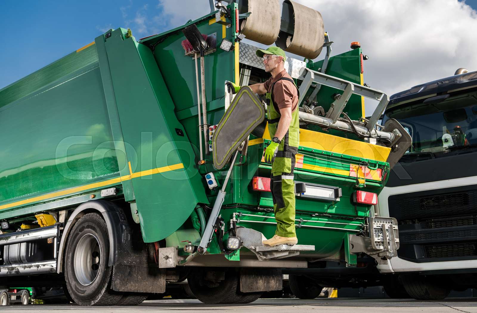 Caucasian Modern Garbage Truck Worker and the Vehicle. | Stock image ...
