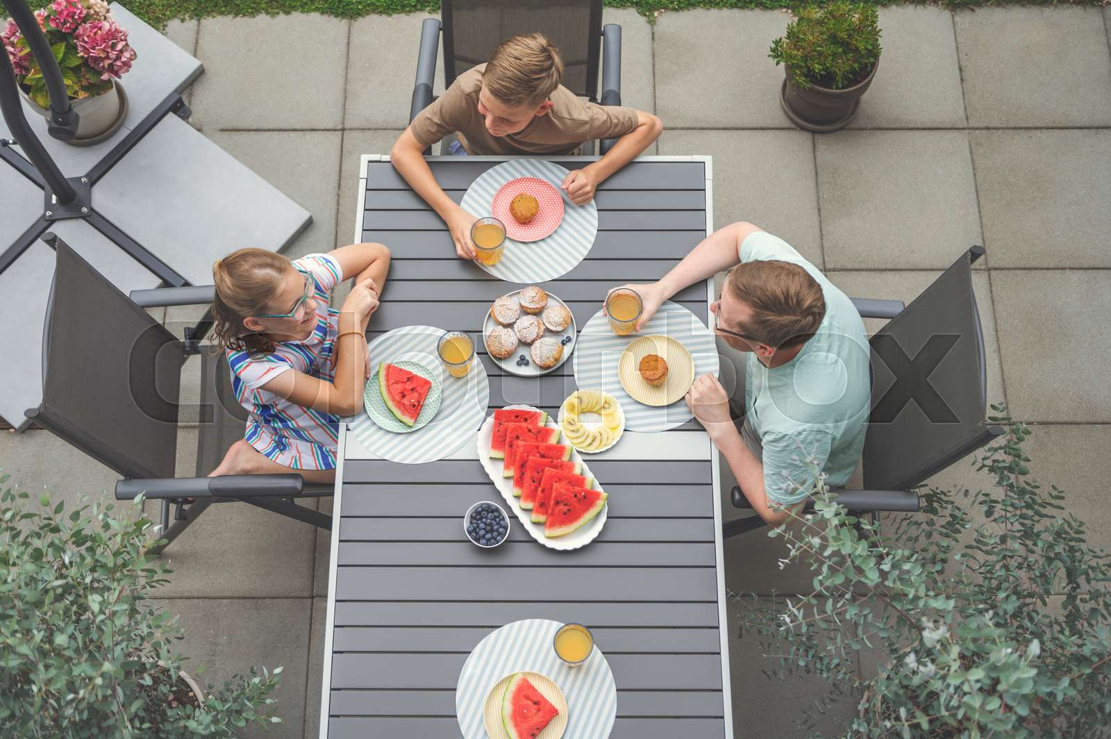 Top view of a happy family having brunch together outdoors | Stock ...