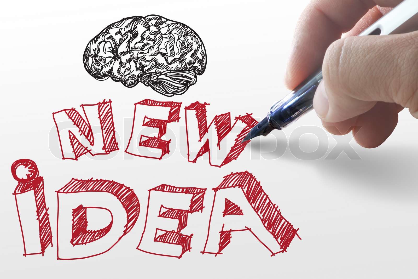 hånd tegning på papir " ny idé" | Stock foto | Colourbox