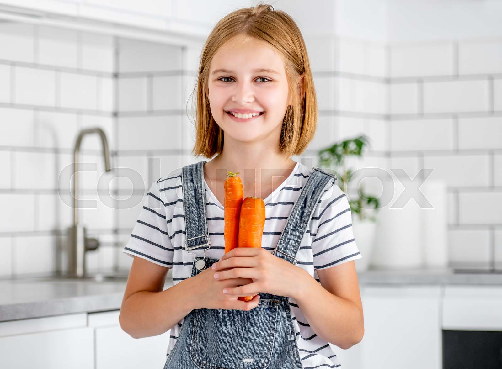 Preteen girl at kitchen | Stock image | Colourbox