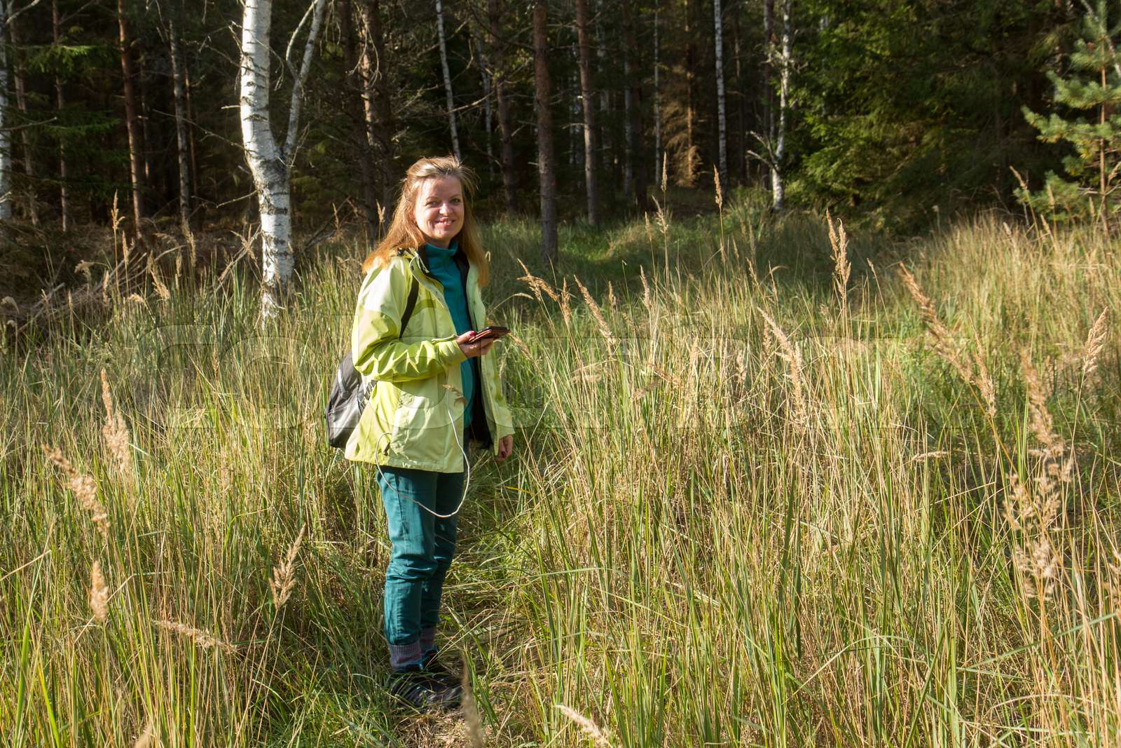 Woman play Geocaching. | Stock image | Colourbox