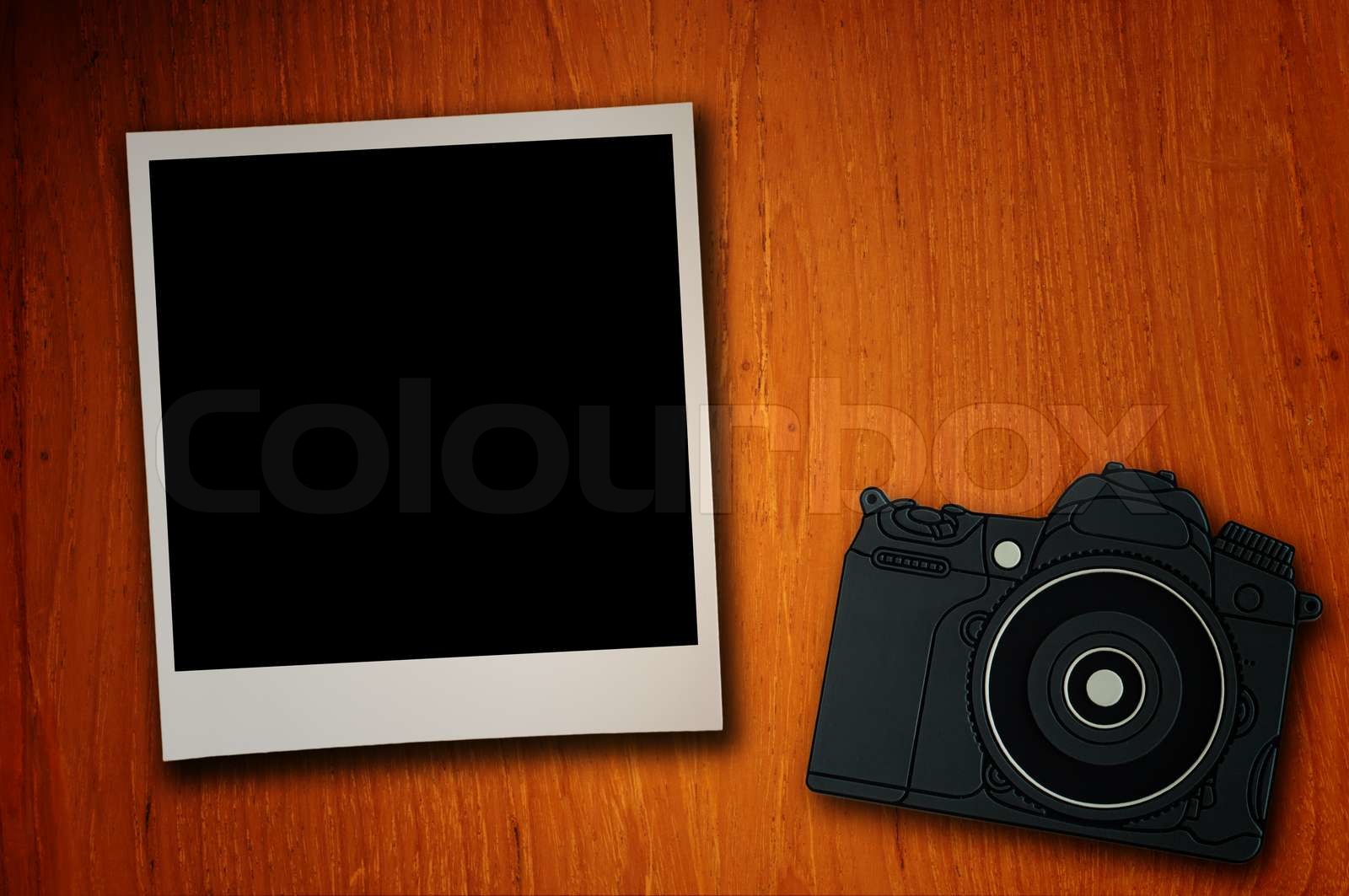 blank photo paper and camera | Stock image | Colourbox