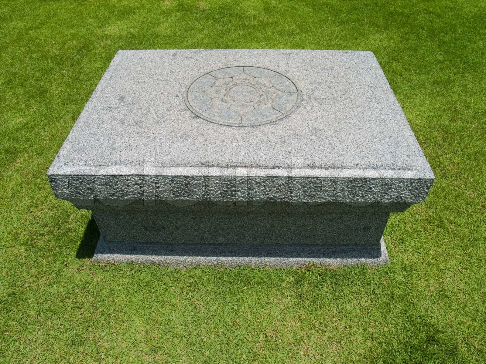 Stone bord på græs | Stock foto | Colourbox