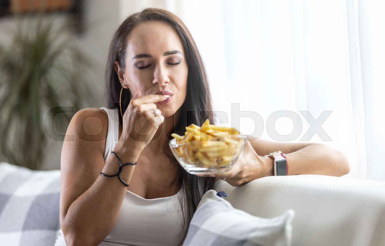 Woman Licks Her Finger Enjoying The Taste Of Crispy And Soft Fresh