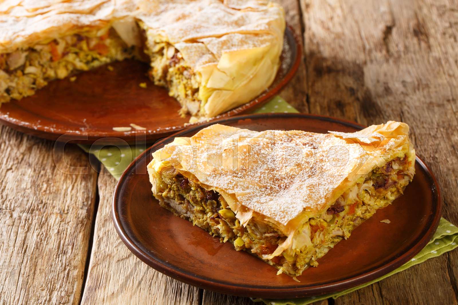 Piece Chicken Bastilla pastilla Moroccan pie closeup in the plate ...