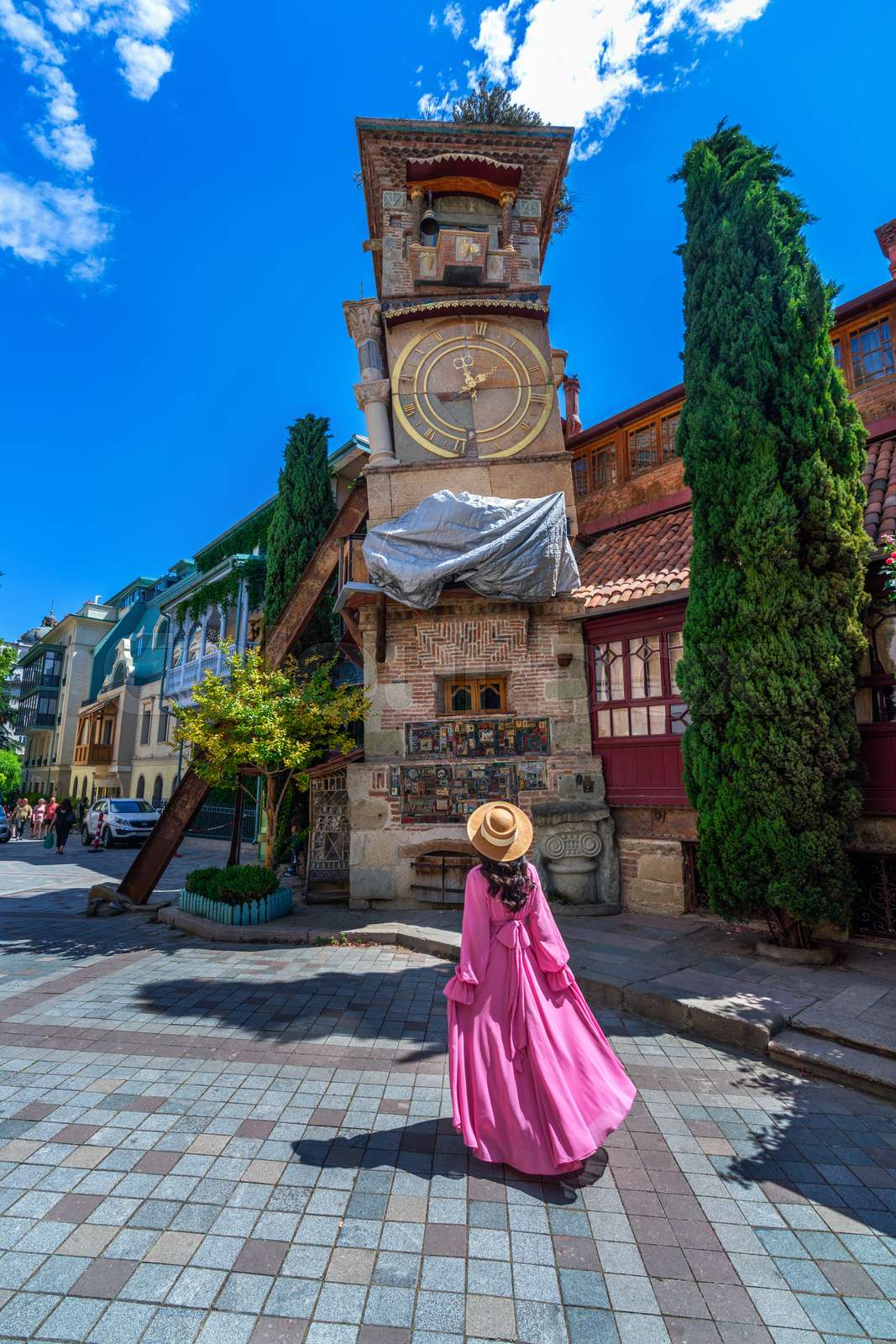 Woman walking at Leaning Clock Tower in Tbilisi, Georgia. | Stock image ...